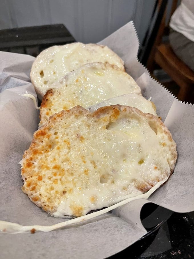 Garlic bread with cheese that stretches to the moon and back—worth every bit of tomorrow's garlic breath.