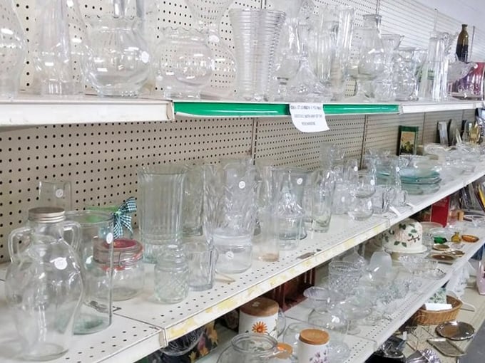 Glassware galore! Pitchers, tumblers, and vases standing at attention like transparent soldiers. Your next dinner party's secret weapon is hiding on these shelves.