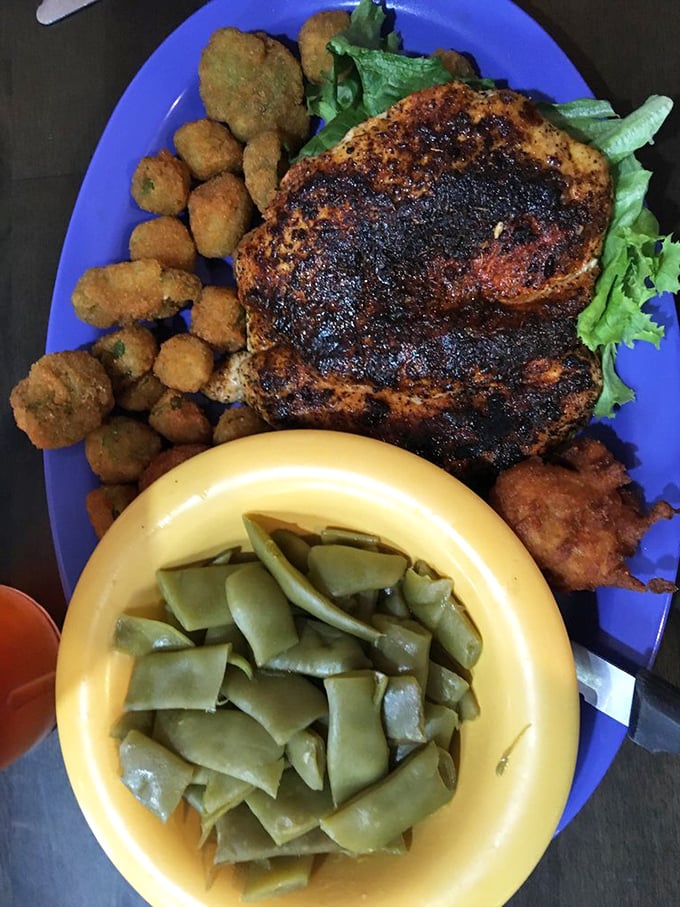 This isn't just grilled chicken—it's a Southern feast with perfectly seasoned meat, fried okra nuggets, and green beans cooked with respect.