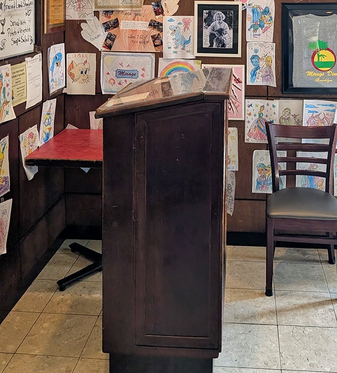Children's drawings papering the walls tell the story of generations who've grown up eating pancakes here. Community served alongside the coffee.