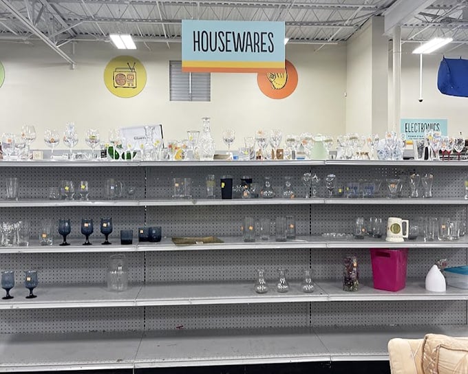 The glassware section sparkles under fluorescent lights—wine glasses and goblets that have toasted countless celebrations now await yours.