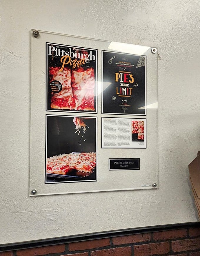 Media recognition displayed without pretension. When your pizza is this good, the accolades find you—not the other way around.