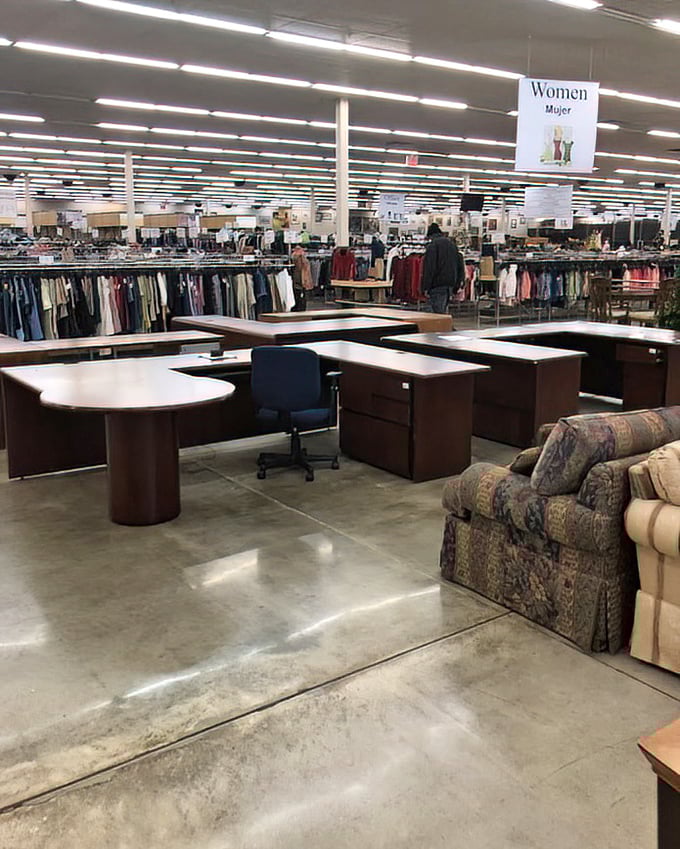 The women's clothing section beckons beyond rows of desks – a retail mullet with business in front, fashion in the back.