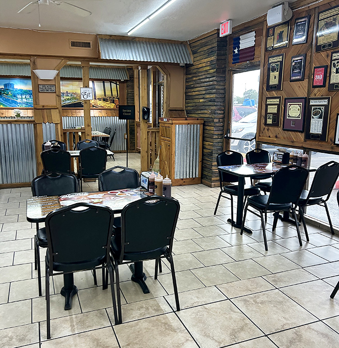 Awards line the walls like a barbecue hall of fame. Not decoration—documentation of a serious commitment to meat mastery.