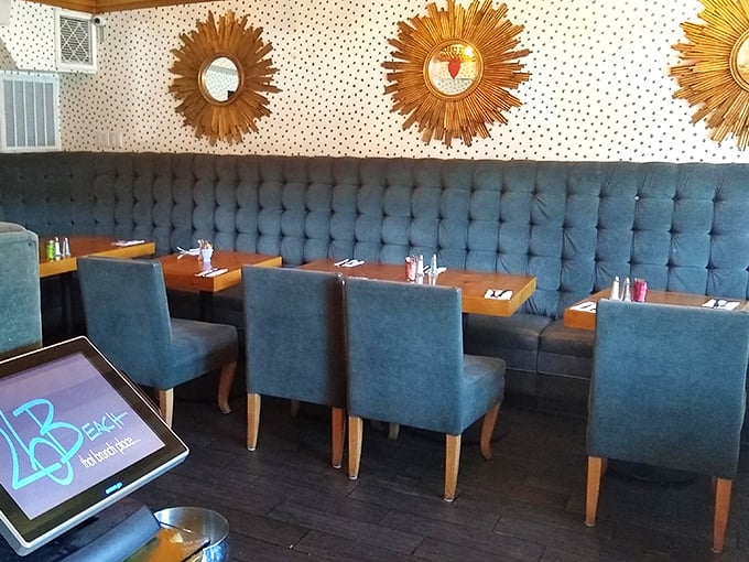 Sunburst mirrors watch over diners like culinary guardian angels. The blue tufted banquette invites you to settle in and stay awhile.