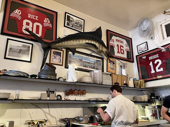 Sports memorabilia and a mounted fish watch over the kitchen – proof that great seafood and local pride go together like sourdough and butter.