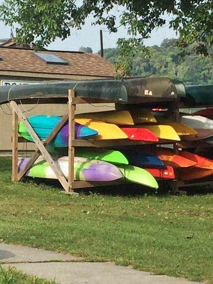 A rainbow of kayaks waits for adventure-seekers. Like choosing from an ice cream shop, the hardest part is picking your favorite color.