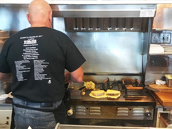 Behind every great breakfast is a focused cook working magic on a well-seasoned grill—the unsung hero of your morning happiness.