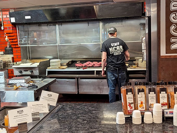 Where the magic happens—a glimpse into the kitchen reveals the careful choreography behind your endless parade of perfectly cooked steaks.
