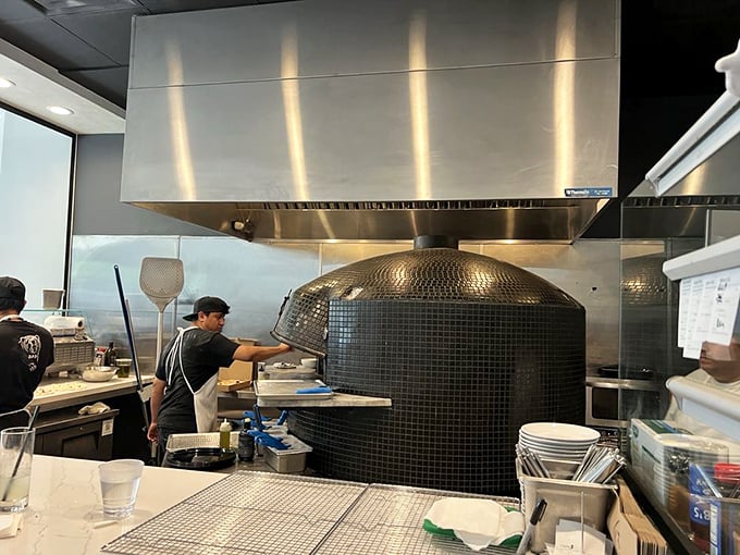 The pizza oven—a tiled temple of heat where dough undergoes its magical transformation. Respect the process, reap the rewards.