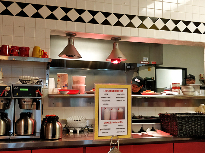 The kitchen's heart is on full display – heat lamps glowing like beacons of hope for hungry patrons awaiting their comfort food fix.