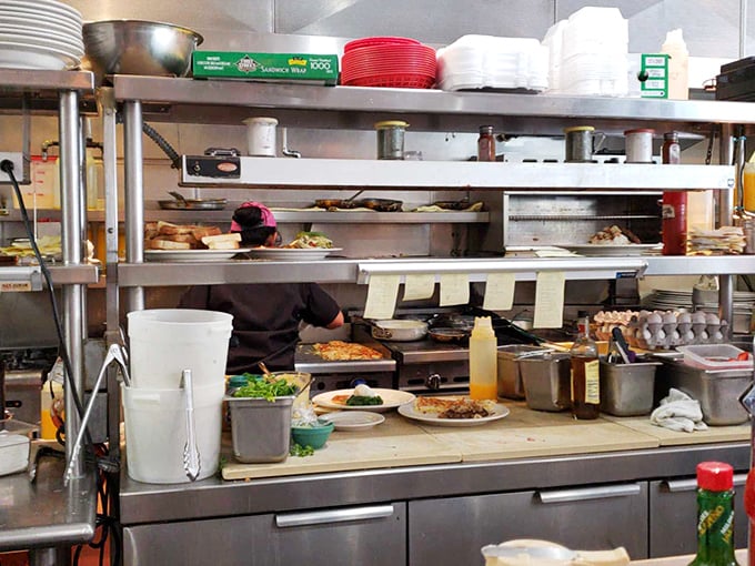The kitchen—where breakfast magic happens at lightning speed, turning simple ingredients into plates that make people line up before sunrise.