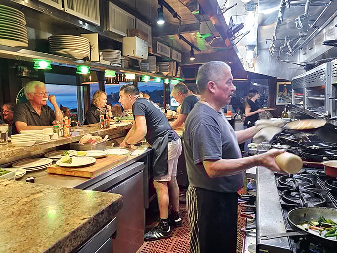 Where culinary magic happens—the open kitchen gives diners front-row seats to the sizzling, steaming symphony of seafood preparation.