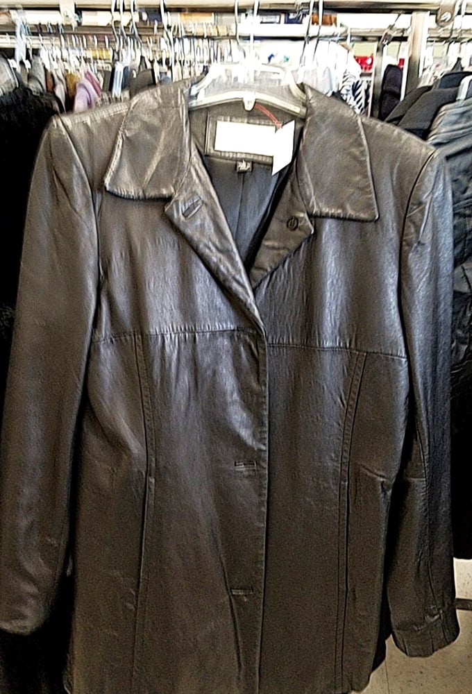 The leather jacket of your dreams hangs patiently, waiting for its second act. Previous owner's cool factor included at no extra charge.