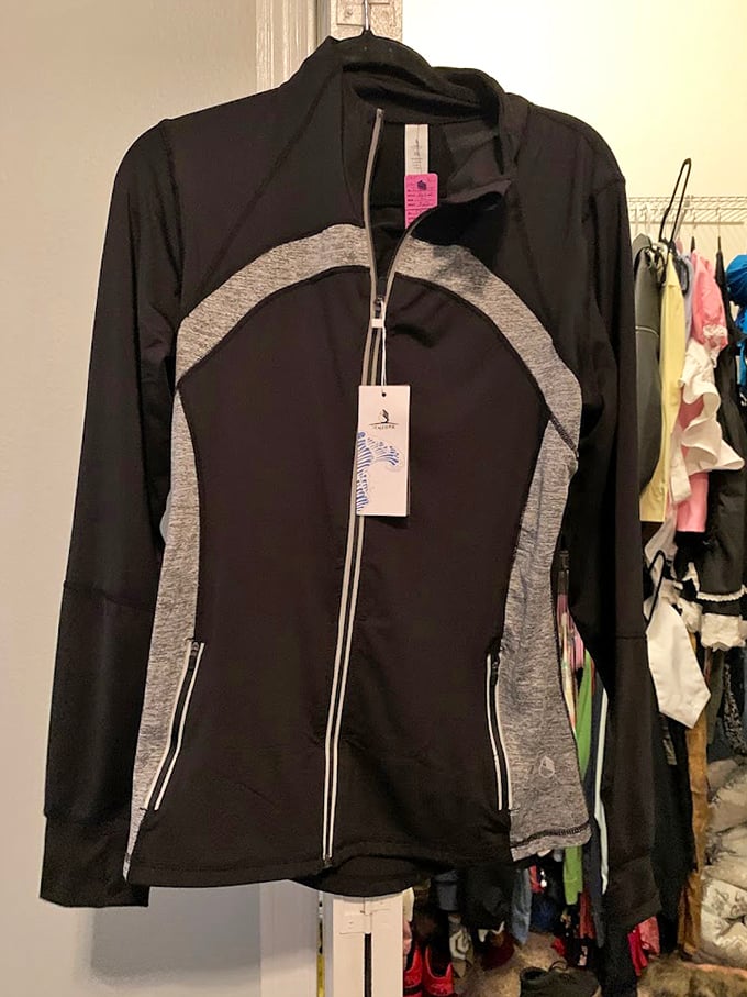 Brand new with tags—the holy grail of thrift shopping. This athletic jacket proves sometimes the best treasures aren't vintage at all.