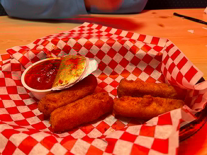 Mozzarella sticks: where the exterior crunch gives way to that perfect cheese pull. The marinara's just there to make it socially acceptable.
