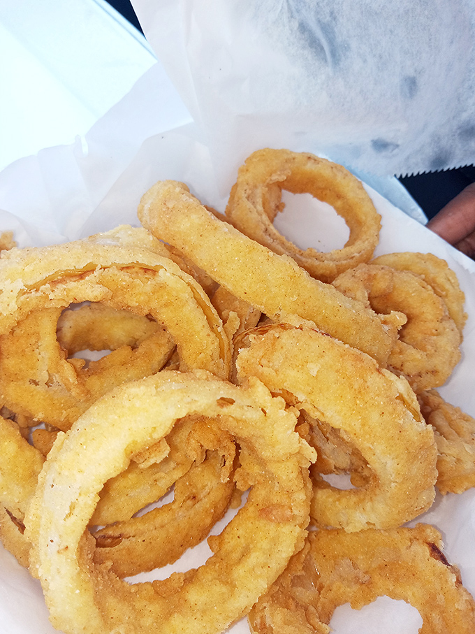 Onion rings with architectural integrity. These golden halos are sturdy enough to propose with, delicious enough to eat instead.