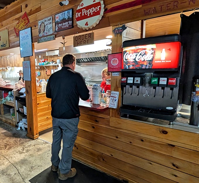 The order counter—where dreams begin and diets end. That soda fountain has witnessed countless moments of pre-meal anticipation.