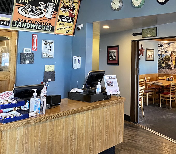 Blue walls, vintage signs, and a cash register that's seen it all – the front counter at Jerry's is where transactions become connections.