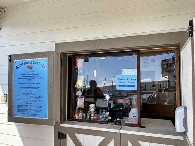The ordering window—portal to happiness. Where dreams of perfect seafood begin their journey to becoming delicious reality.
