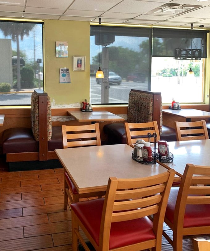 Corner booths bathed in natural light—where breakfast philosophers ponder life's great questions, like "pancakes or waffles?"