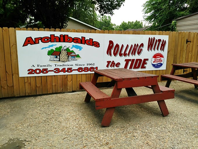 Red picnic tables under open sky where you can enjoy your barbecue like civilized outdoor dining enthusiasts.