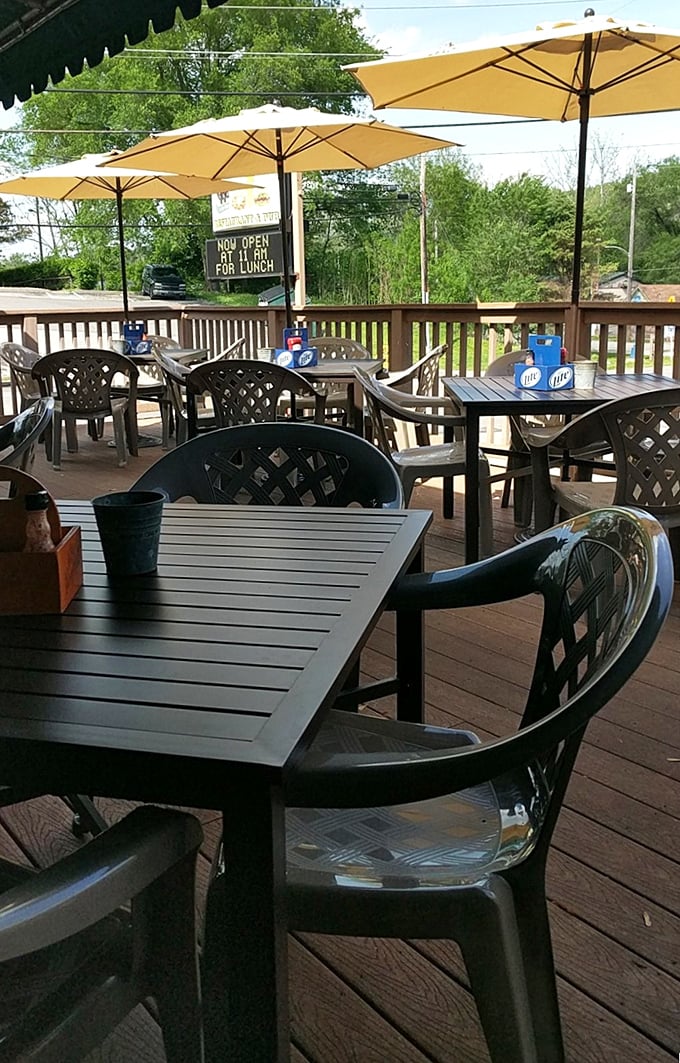 The outdoor seating area where summer breezes, cold drinks, and the satisfaction of discovering a hidden gem all come together perfectly.