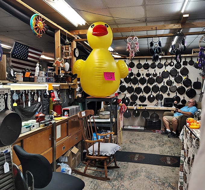 The giant inflatable duck presides over a kingdom of cast iron skillets—the unofficial mascot of unexpected flea market finds.
