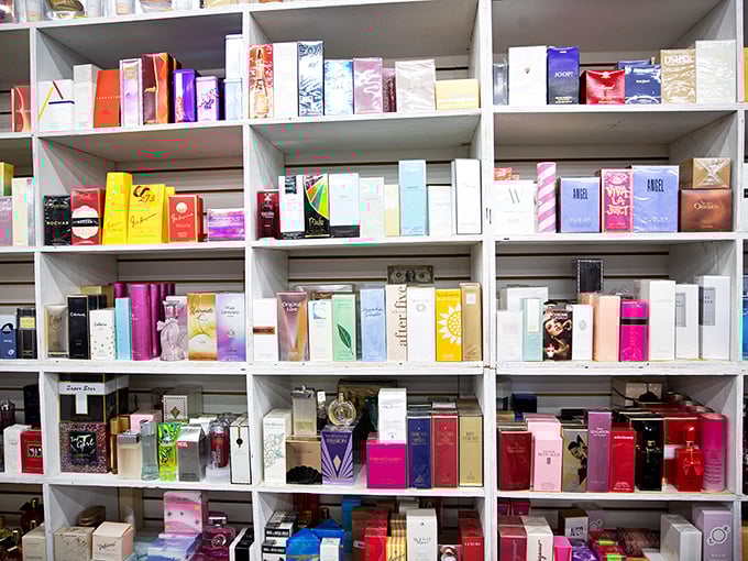 Perfume shelves offer a fragrance library where designer scents meet bargain prices—because smelling like a million bucks shouldn't cost nearly that much.