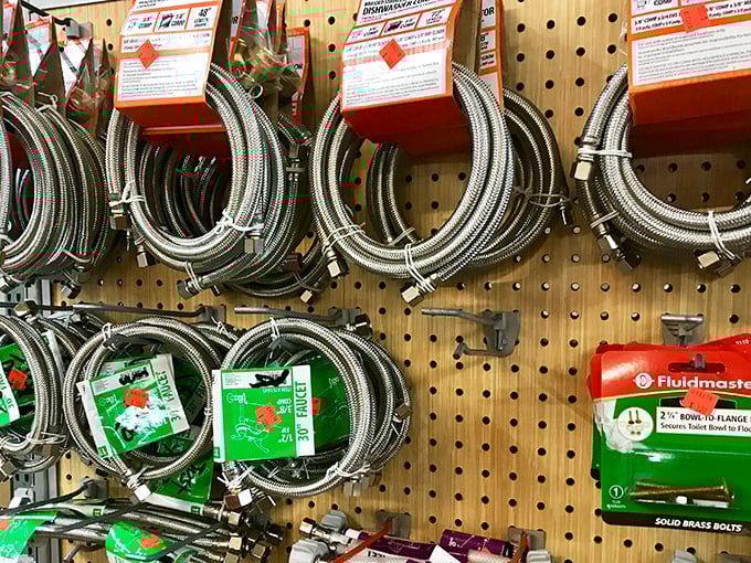 The plumbing supply wall—where weekend warriors and professional fixers alike find that elusive part that's been leaking since last Christmas.
