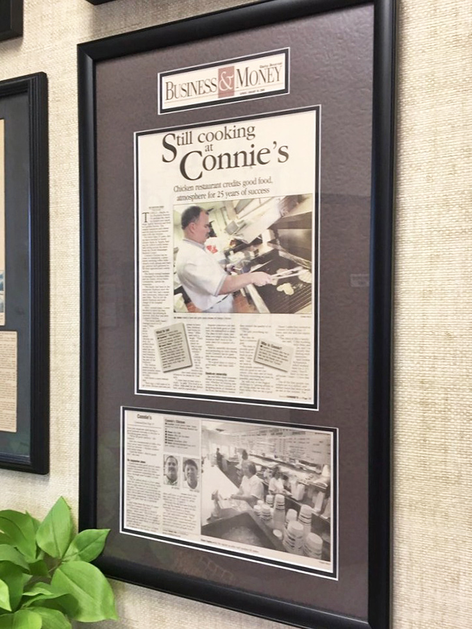 Framed newspaper clippings tell the story of decades of consistency—the kind of recognition that can't be bought with marketing dollars or social media campaigns.