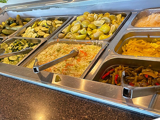 The salad bar—a colorful United Nations of vegetables where pickles diplomatically negotiate with coleslaw for your attention.