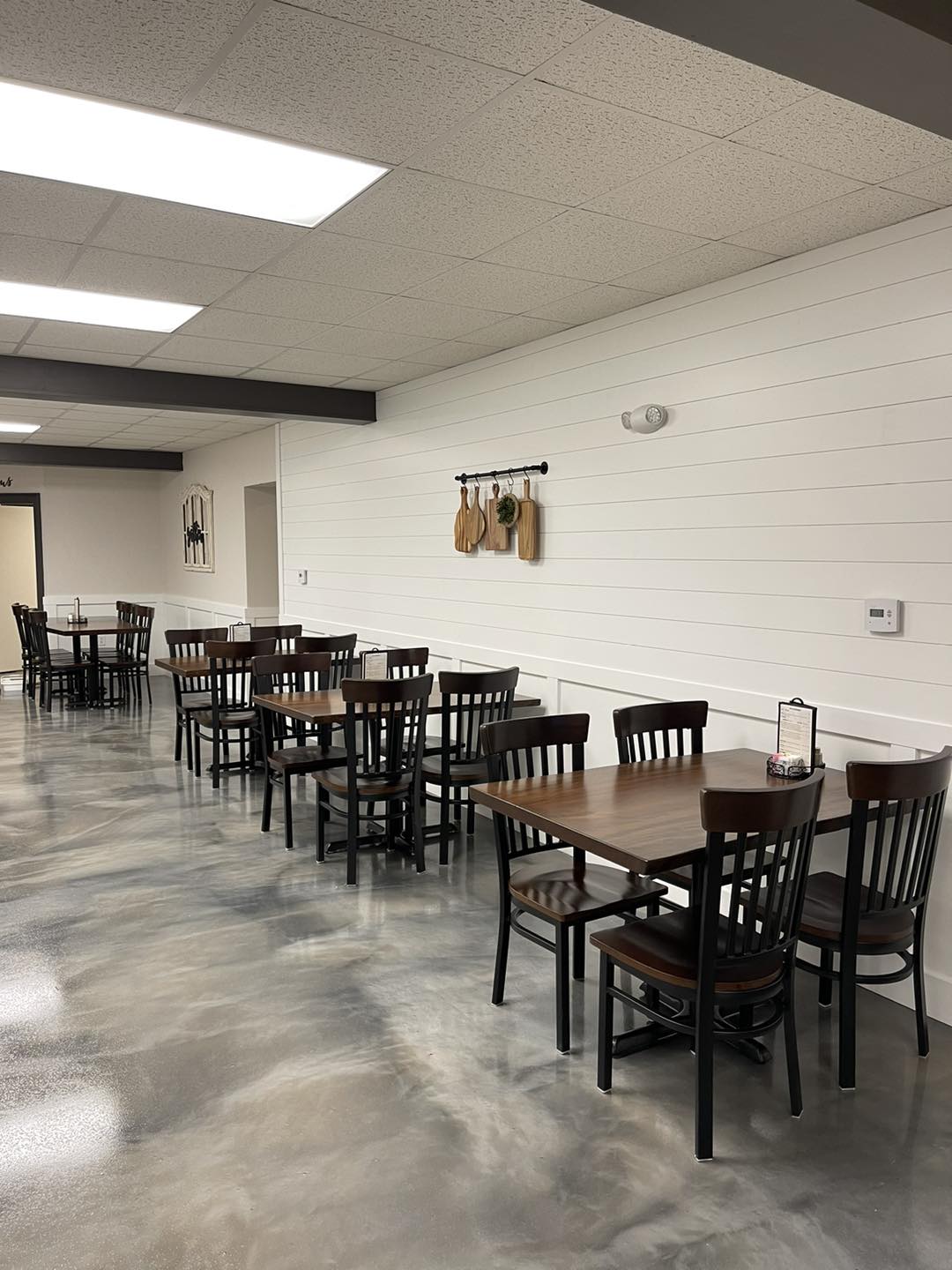 The dining room during a quiet moment—a canvas awaiting the brushstrokes of conversation, laughter, and the clinking of forks against plates.