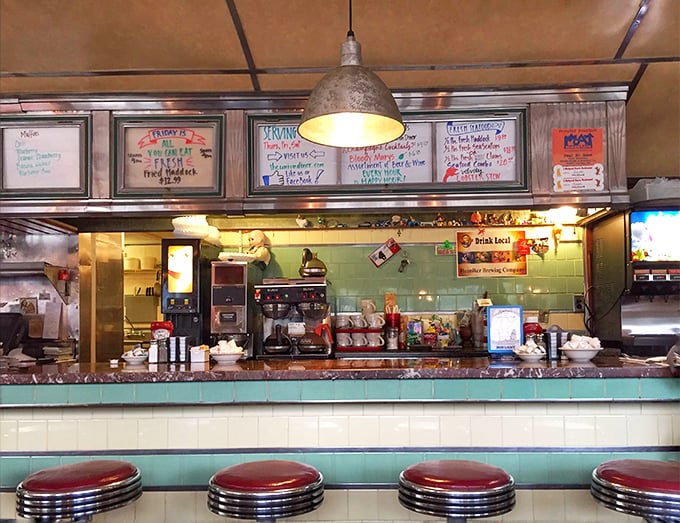 Behind this counter, breakfast dreams come true—handwritten specials on whiteboards promise delights that won't appear on the regular menu.