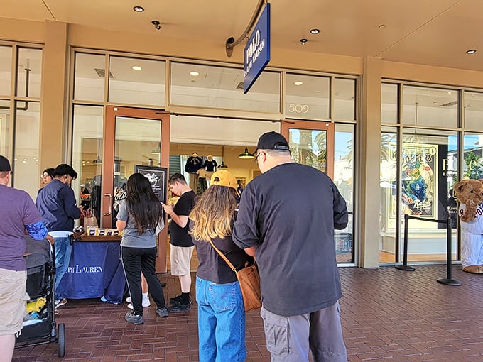 The Ralph Lauren line forms outside – proof that patience is the secret ingredient in outlet shopping success.
