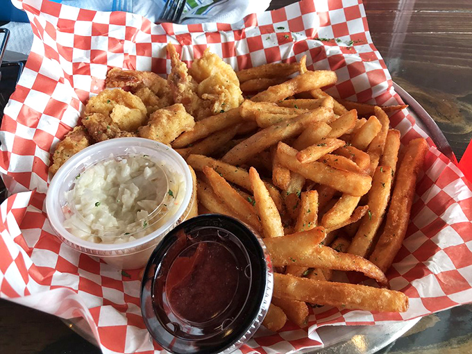 Golden-fried shrimp nestled against crispy fries—comfort food that's dressed for a night out. Two dipping sauces because life's too short for monogamous condiment relationships.