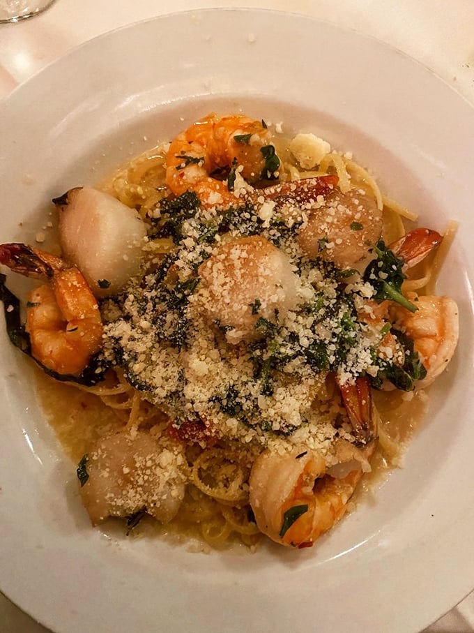 Seafood linguine that could make Neptune himself swim to shore—tender shrimp and scallops nestled among perfectly al dente pasta.