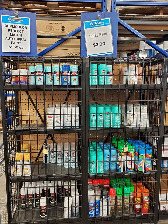 Spray paint prison – these colorful cans are contained for your protection, but their potential for transformation is unlimited.