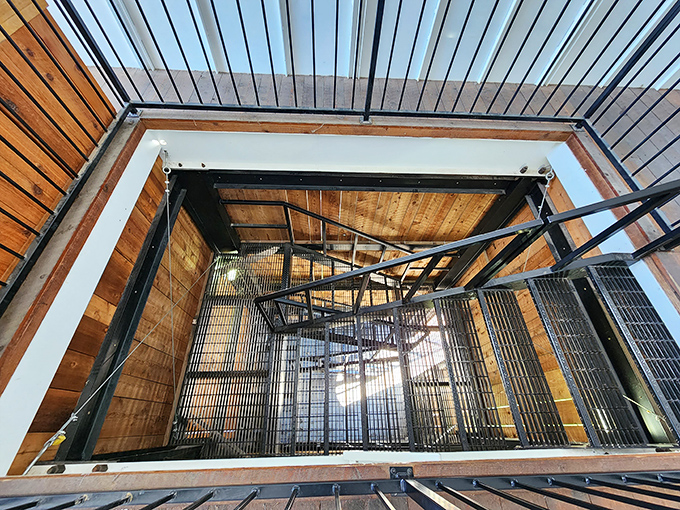 Looking down the metal staircase reveals the craftsmanship that went into creating this functional monument to communication. Each step a journey into postal history.