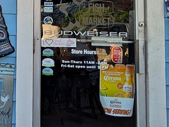 Store hours posted on the door – crucial information for planning your seafood pilgrimage to this Liberty landmark.