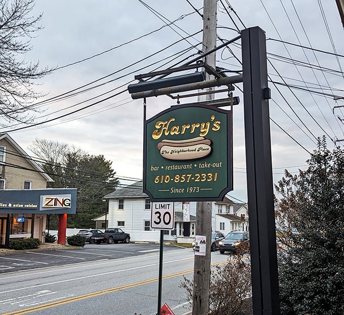 The sign says "The Neighborhood Place" – three words that perfectly capture what makes Harry's more than just somewhere to eat.