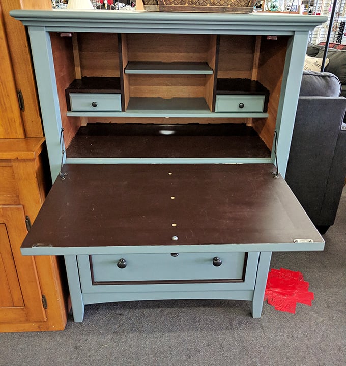This mint-colored secretary desk whispers tales of handwritten letters and balanced checkbooks from a pre-digital era.