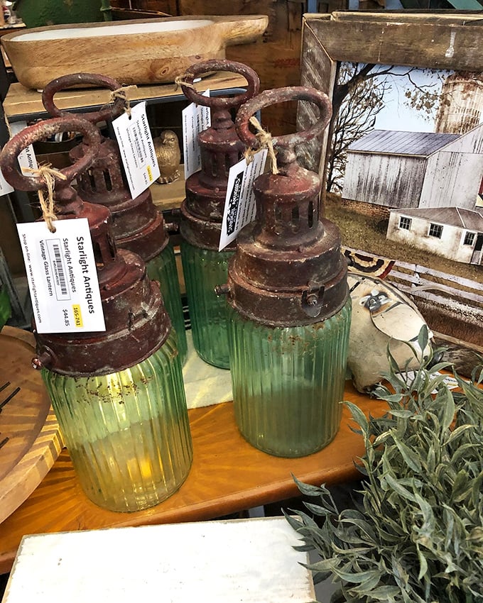 These vintage lanterns glow with the patina of history. The green glass bases look like they once illuminated conversations worth remembering.