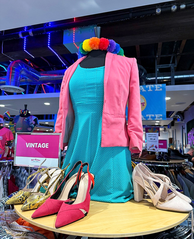 A vintage display that screams fun with its color coordination and thoughtful styling – the mannequin's rainbow headpiece is just the cherry on top.