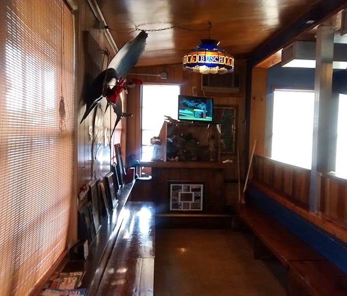Wooden paneling, stained glass lighting, and a TV in the corner—the waiting area that's seen generations of seafood pilgrims.