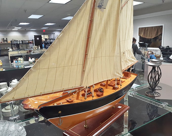 That model sailboat isn't just decor – it's someone's miniature voyage to adventure, now docked at a bargain price.