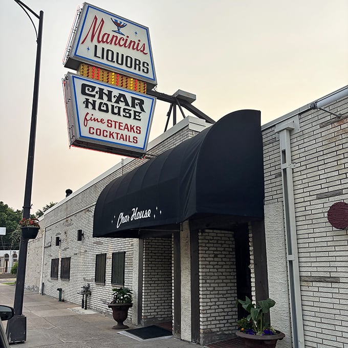 Mancini's vintage sign isn't just nostalgic – it's a time machine to when steaks were serious business and cocktails had character.
