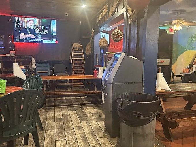 Even the interior corners tell a story – wooden tables, casual seating, and a TV for when you need to check the score between crab leg clusters.