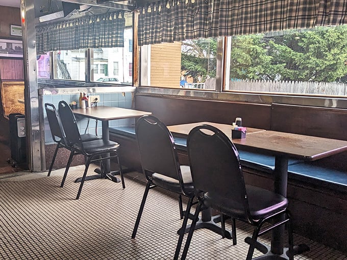 Booth seating that's witnessed first dates, business deals, and family celebrations—these vinyl-covered time machines have absorbed decades of Laurel's stories.