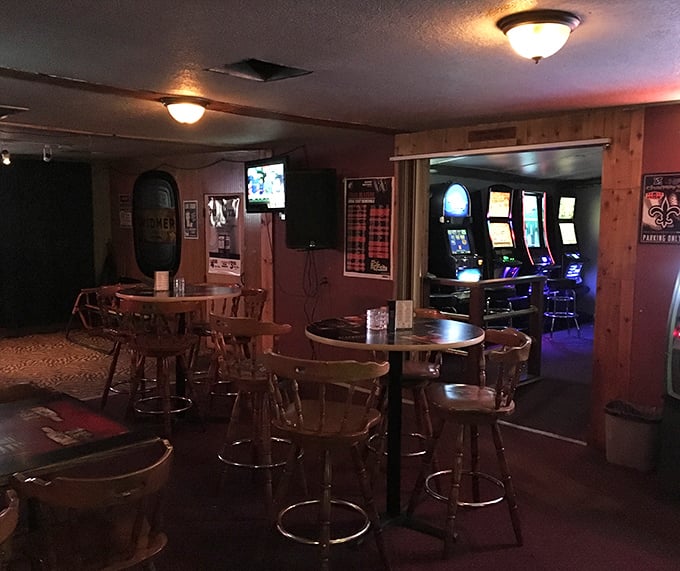 Another angle reveals the gaming area just beyond the dining room – because good food and entertainment are natural companions.